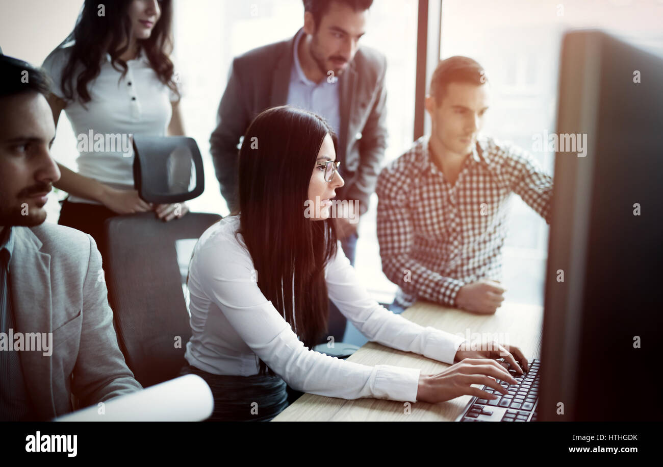 IT colleagues working on software developement project in office Stock ...