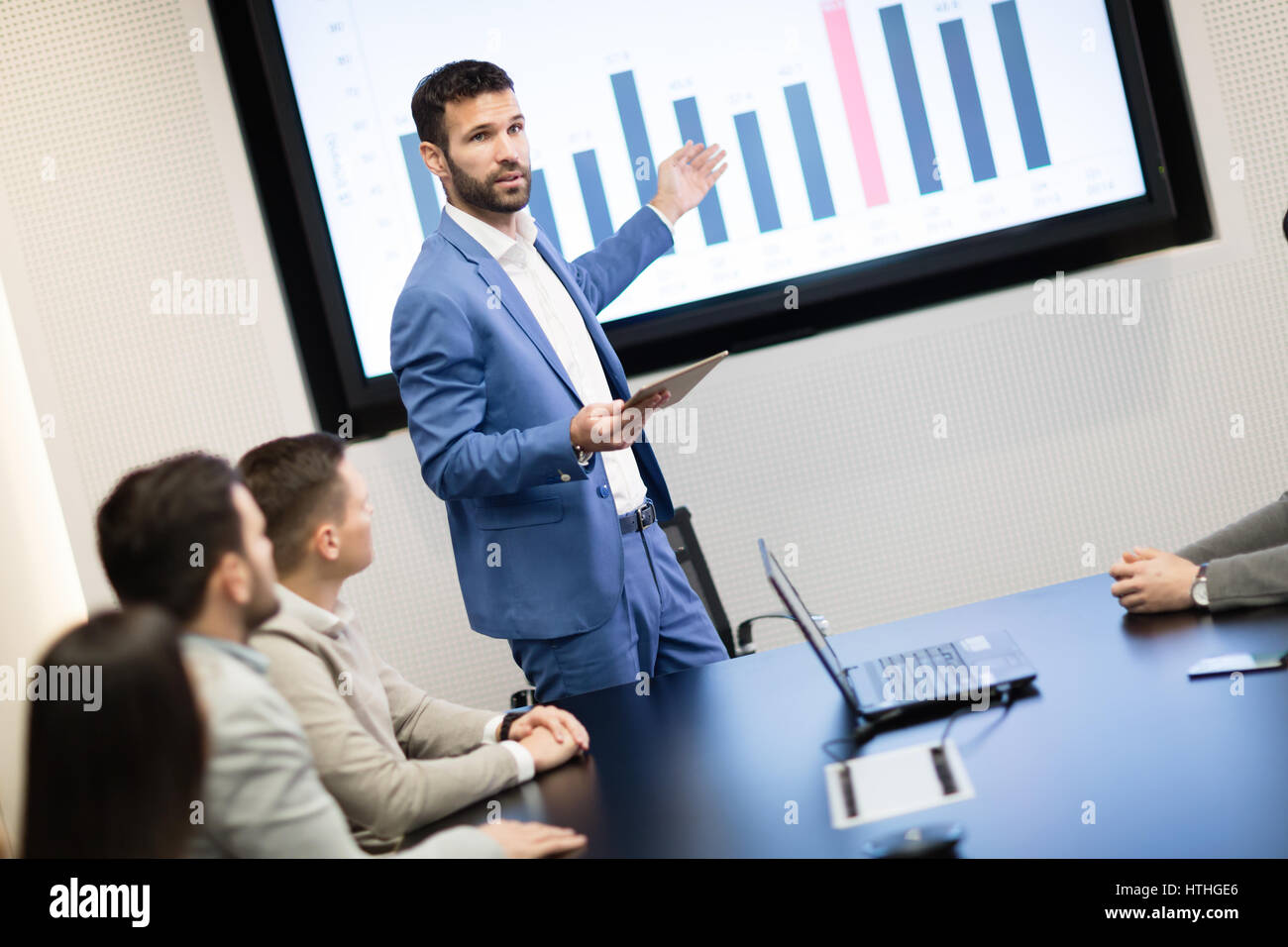 Business people analyzing data at meeting in office and doing ...