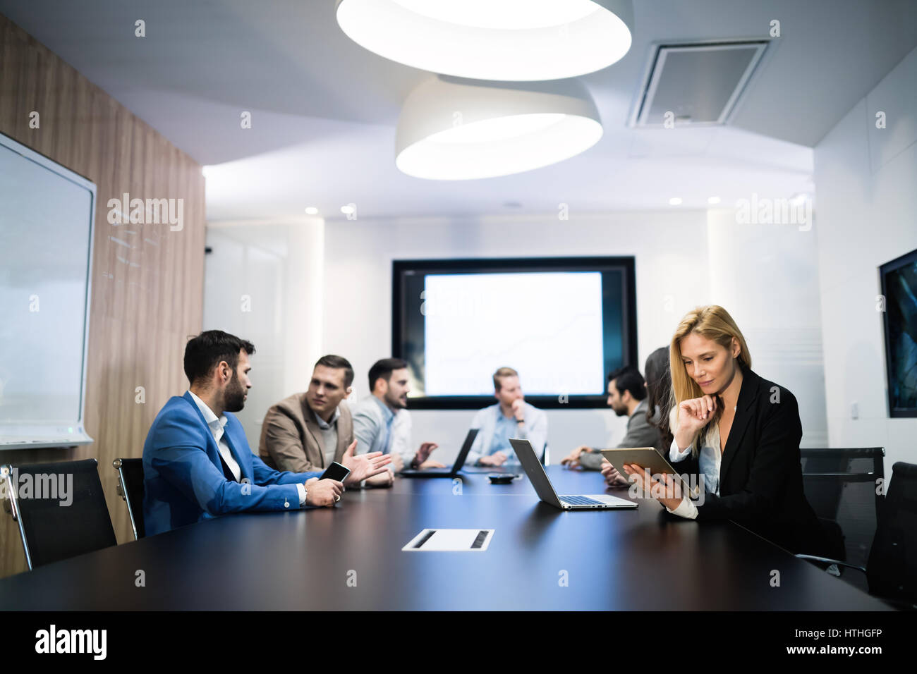 Business meeting and presentation in modern conference room for ...