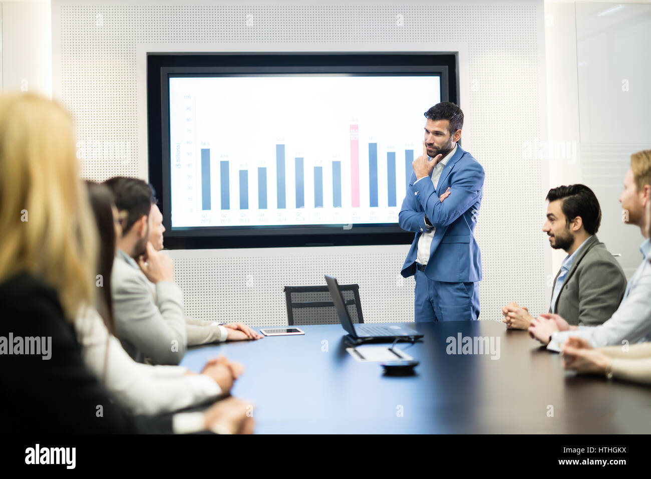 Business people analyzing data at meeting in office and doing ...