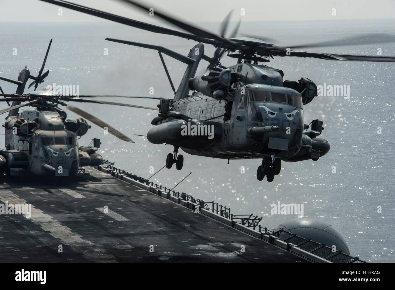 A U.S. Navy CH-53E Super Stallion helicopter launches from the flight ...