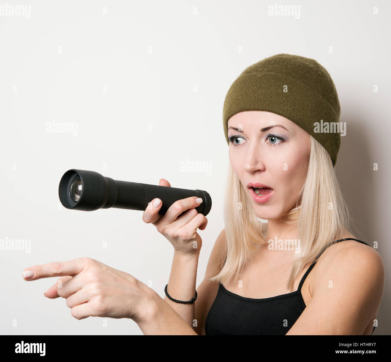 girl in a cap with a flashlight Stock Photo - Alamy
