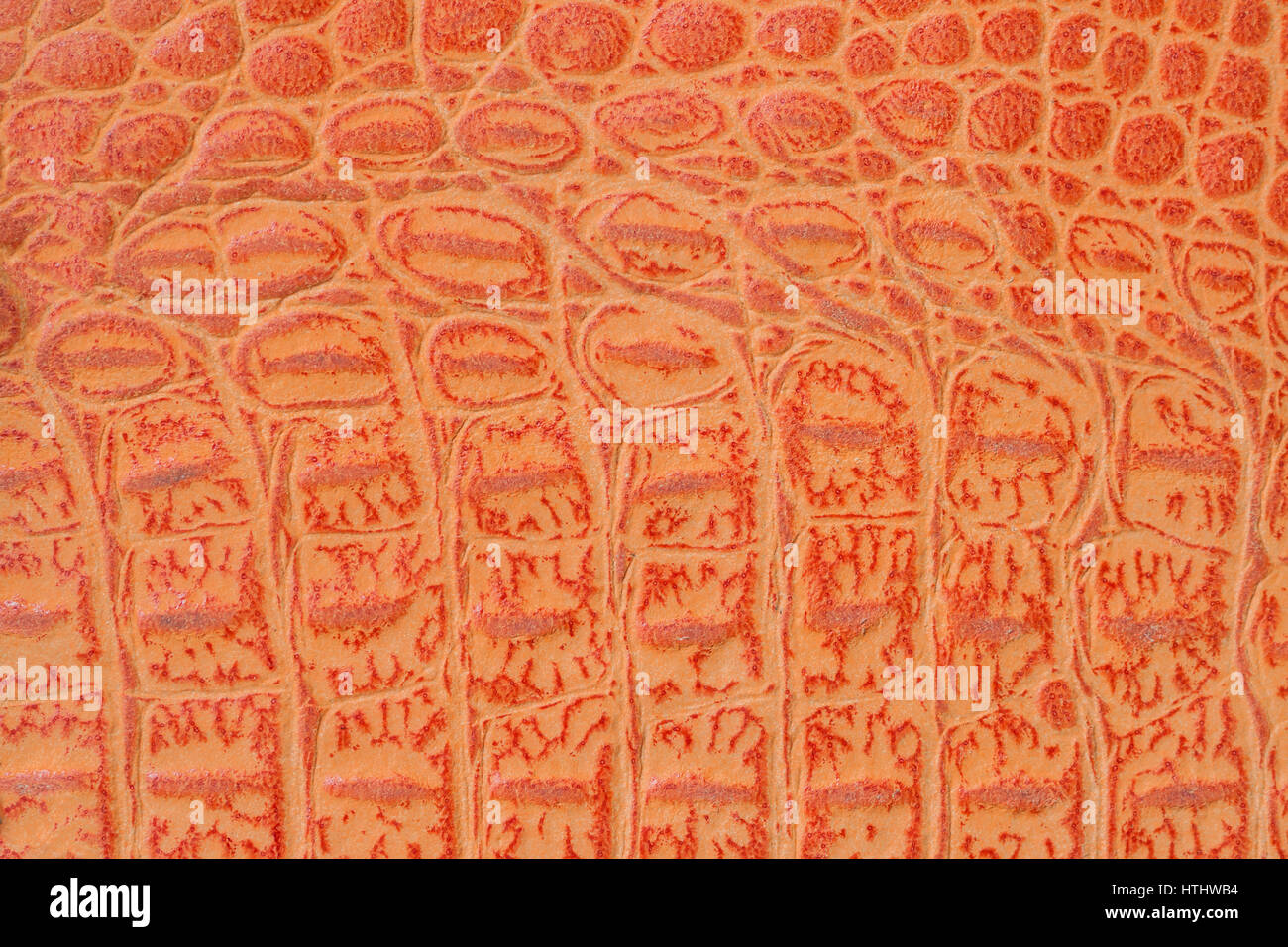 Bright orange scales macro exotic background, embossed under the skin ...