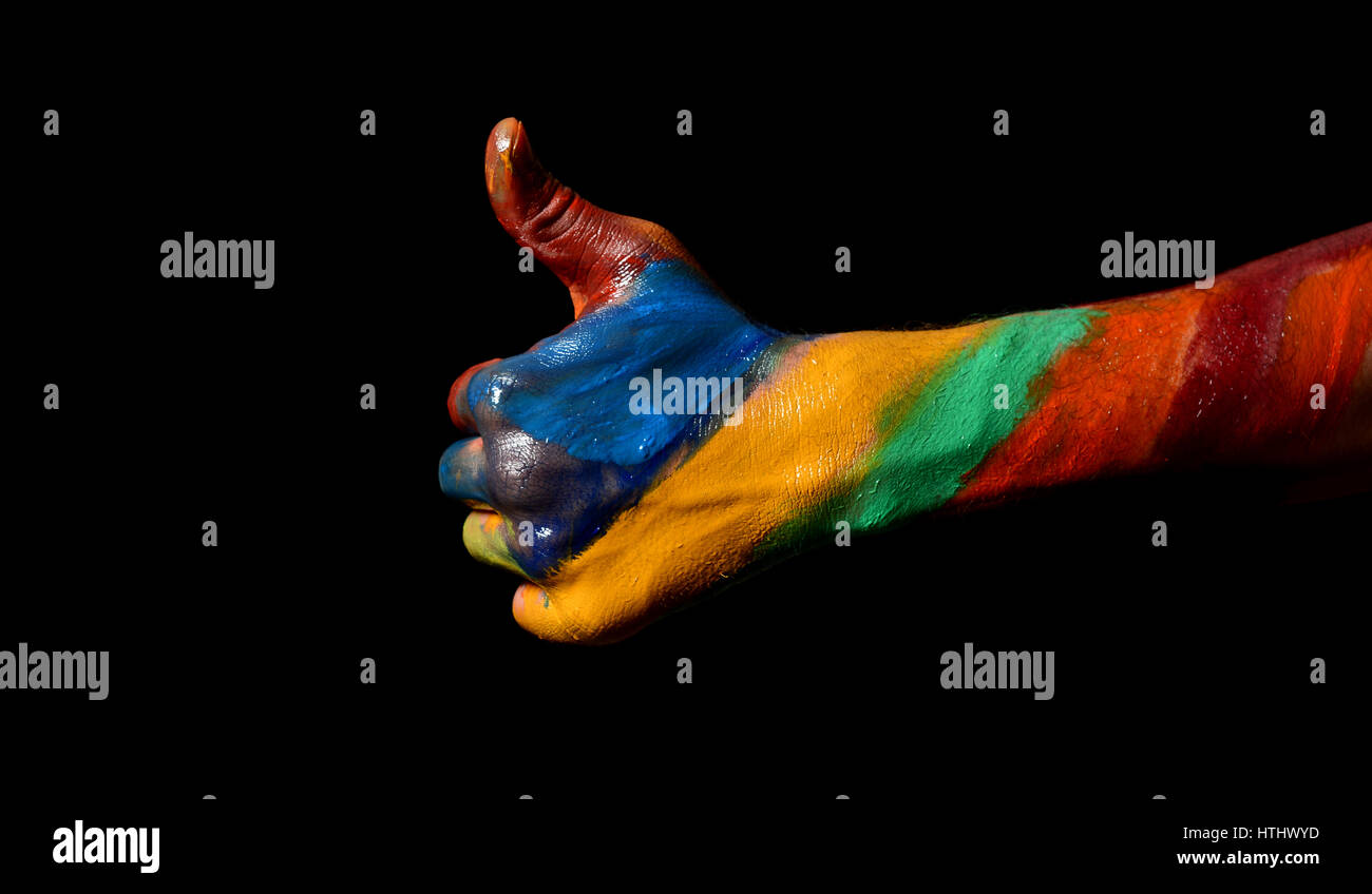 Multi Colors painted hand Thumbs Up Gesture on black background Stock ...