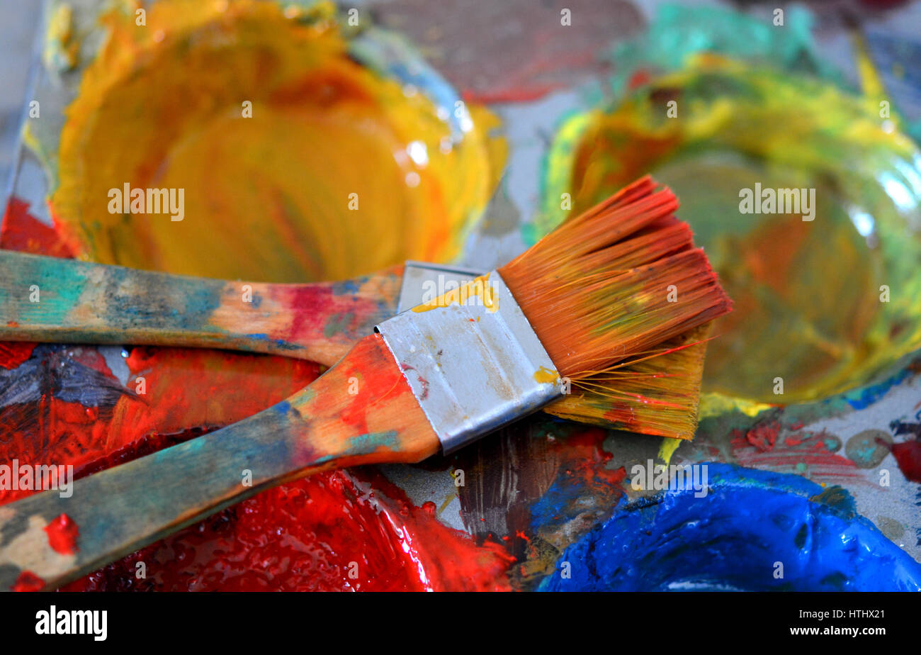 Artist Painting Brushes dipped in Oil Colors Stock Photo - Alamy