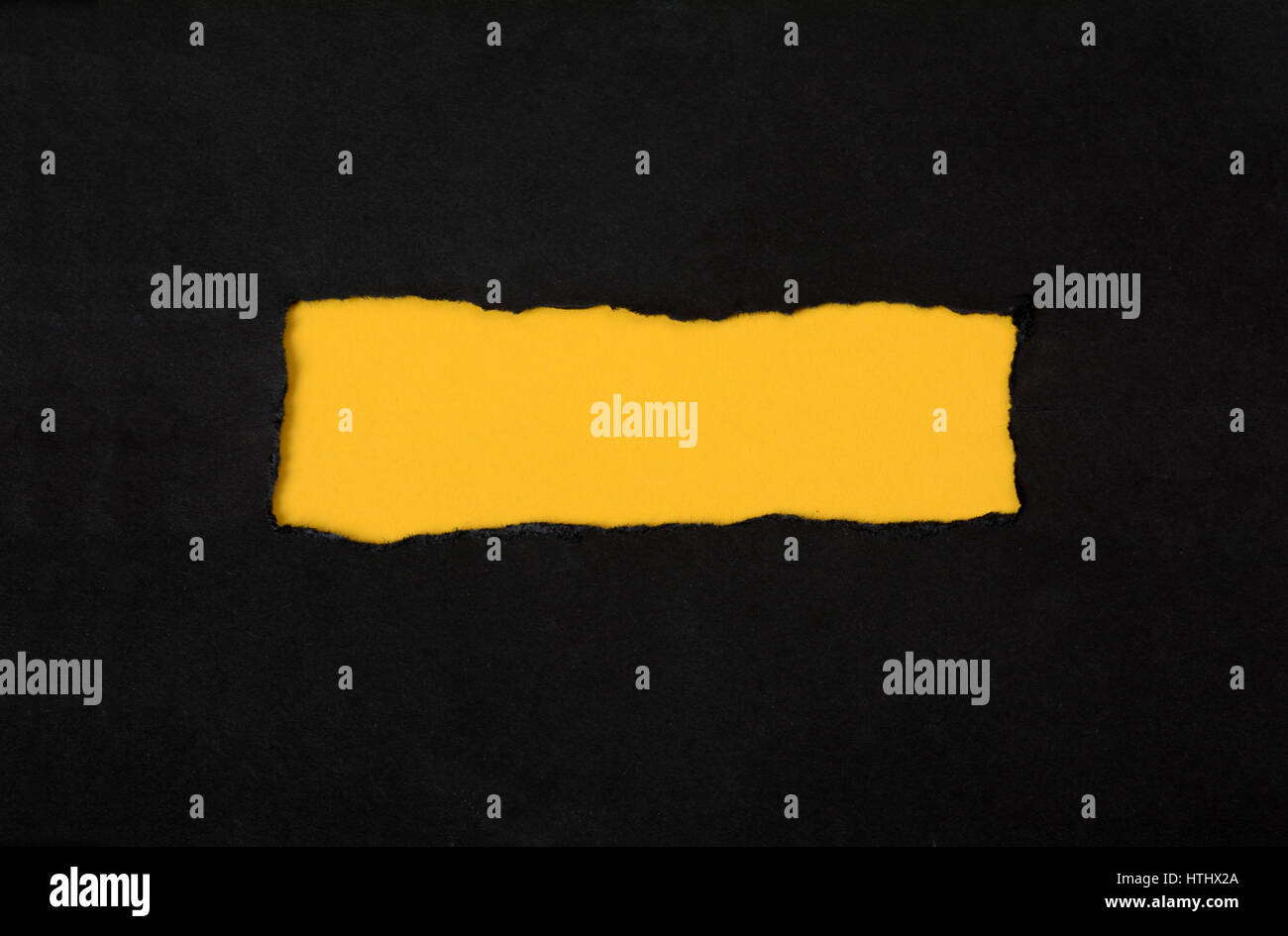 Black Color Paper sheet ripped with yellow in background Stock Photo ...