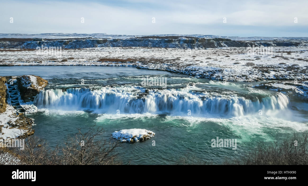 A broad frozen waterfall in Iceland in Winter Stock Photo - Alamy