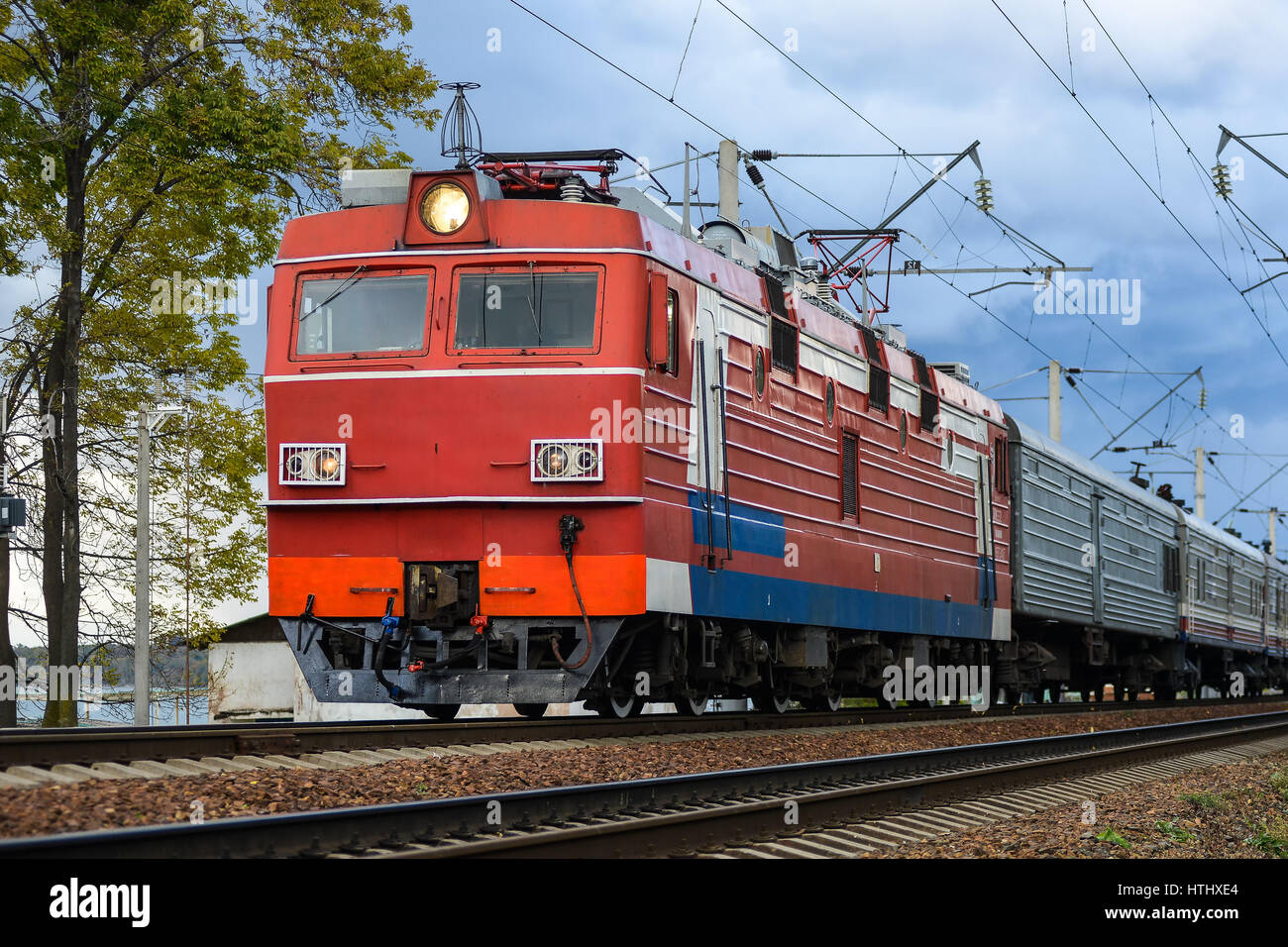 Photo of modern electric train on vintage railroad Stock Photo - Alamy