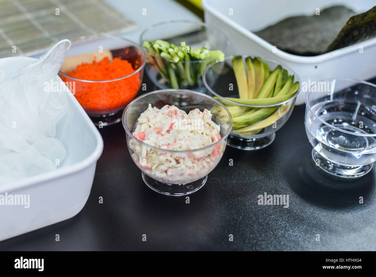 Human hands cooking sushi rolls hi-res stock photography and images - Alamy