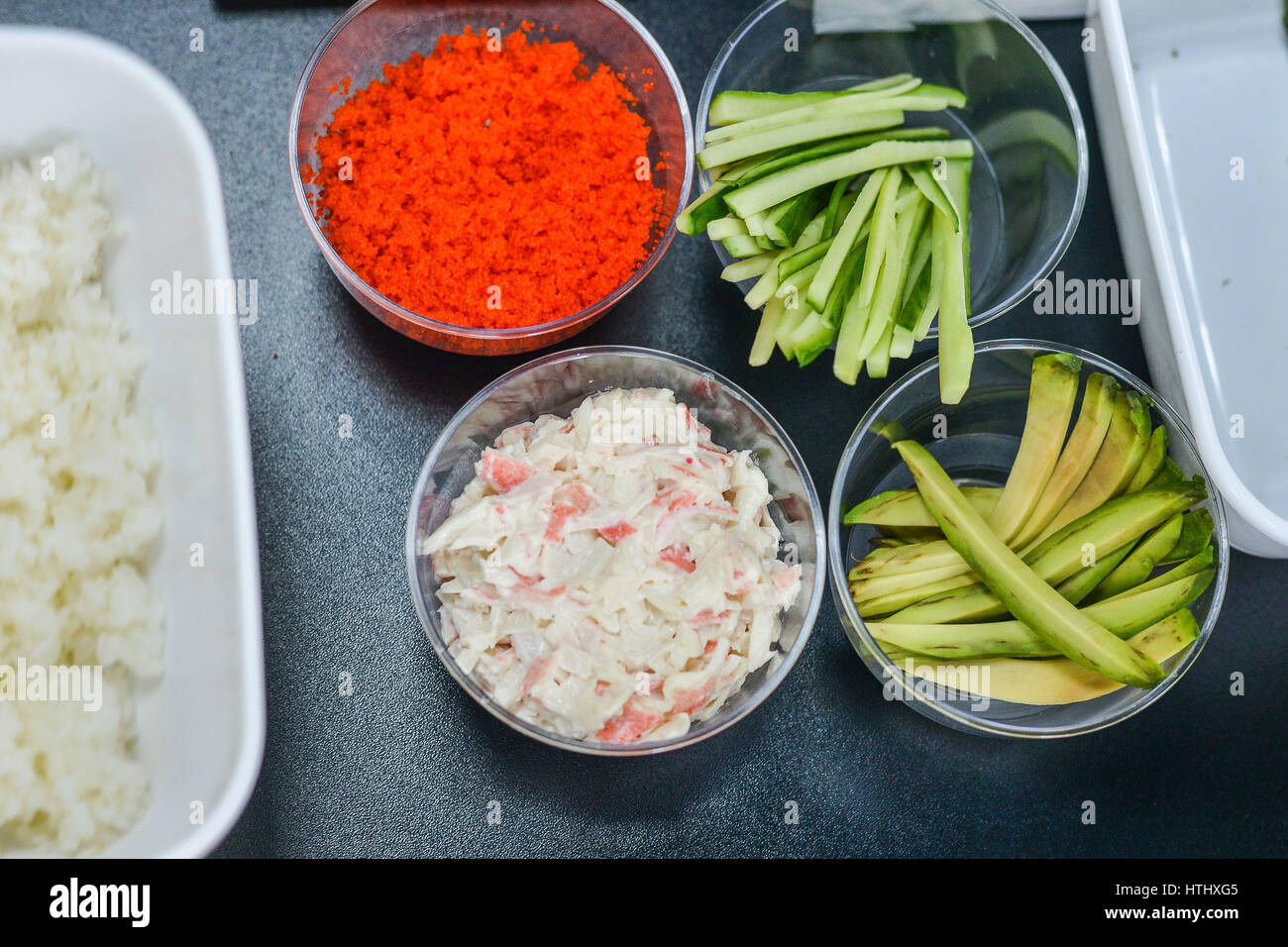 Human hands cooking sushi rolls hi-res stock photography and images - Alamy