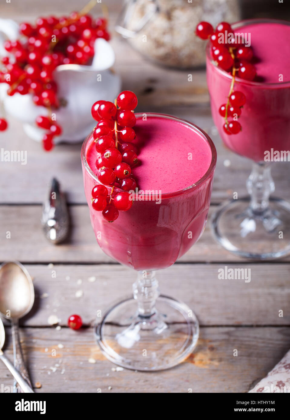 Smoothie, dessert with raspberry and oatmeal in glasses decorated with ...