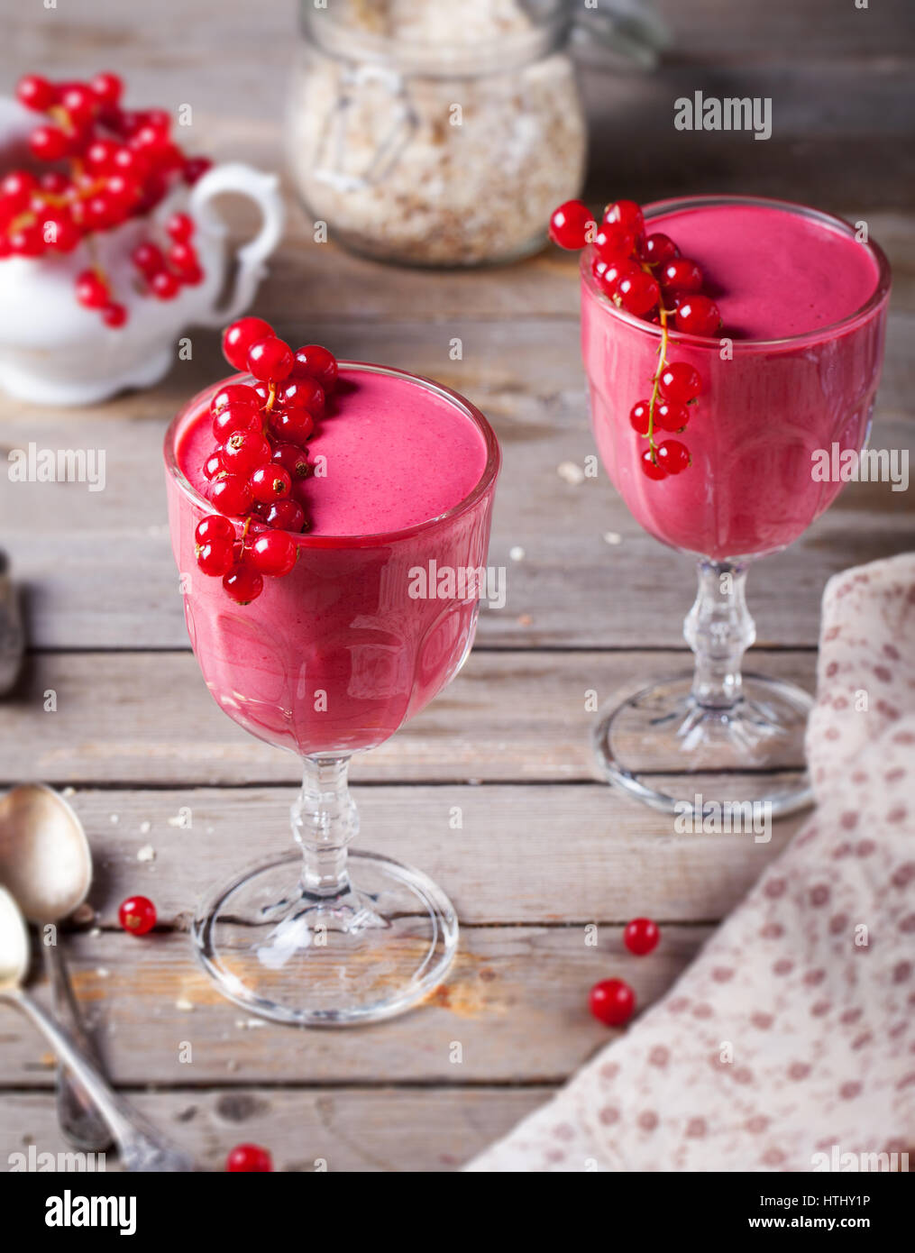 Smoothie, dessert with raspberry and oatmeal in glasses decorated with ...
