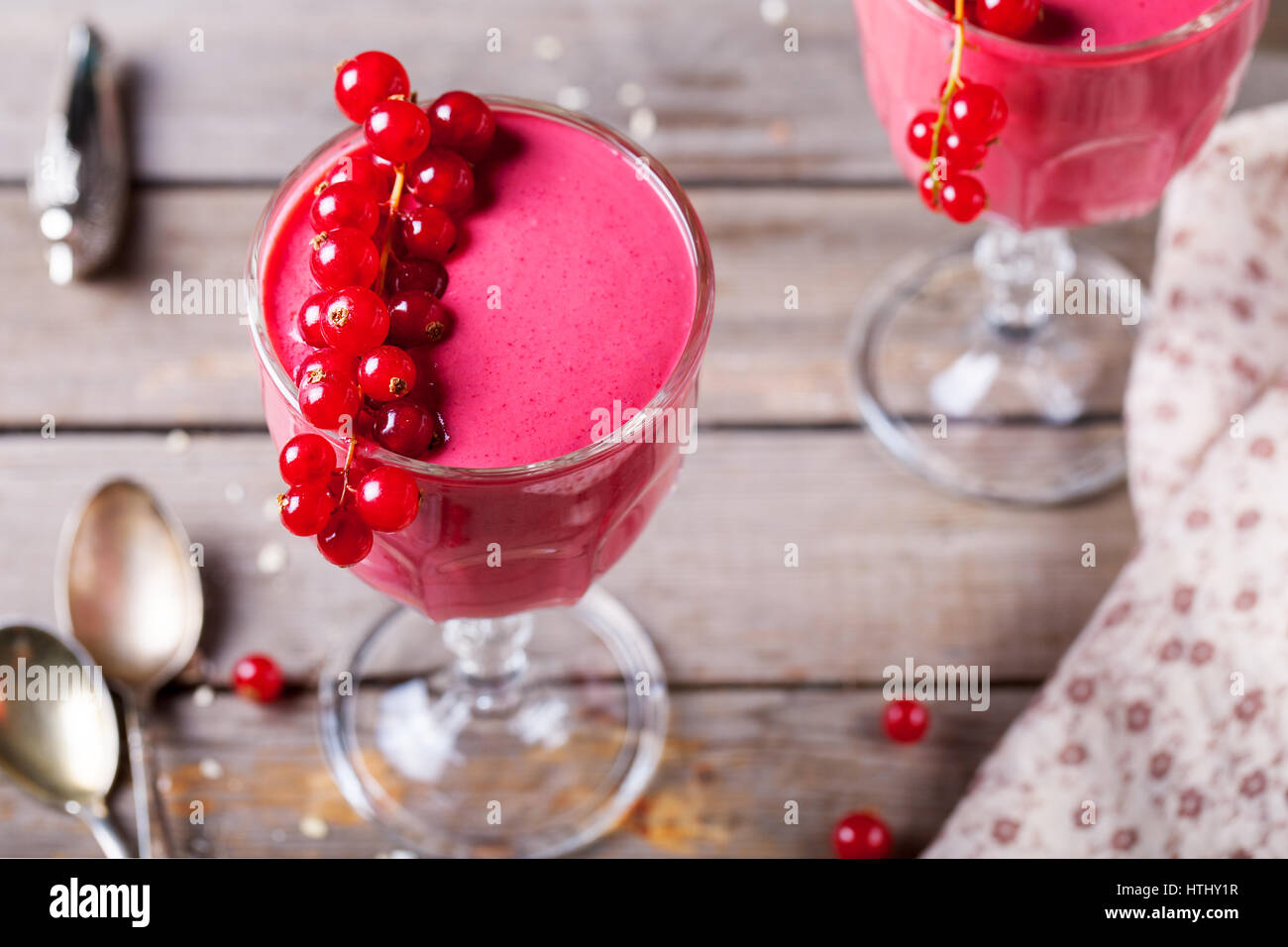 Smoothie, dessert with raspberry and oatmeal in glasses decorated with ...