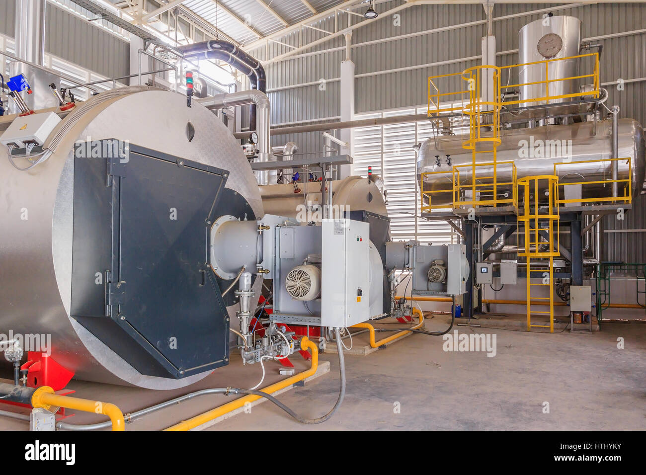 Gas boilers in gas boiler room for steam production Stock Photo - Alamy