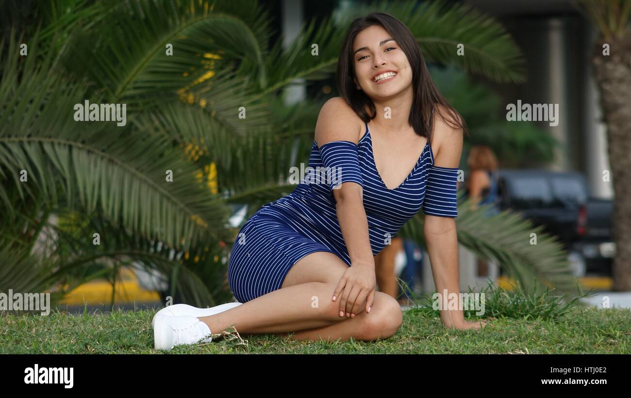 Happy Girl Sitting Stock Photo - Alamy