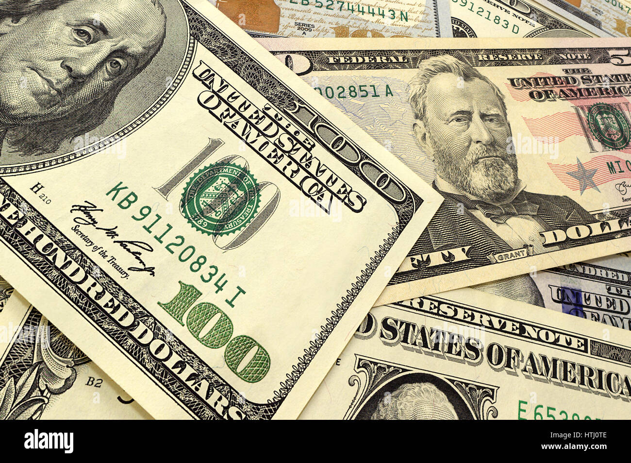 Abstract dollar bills of different denominations background Stock Photo ...