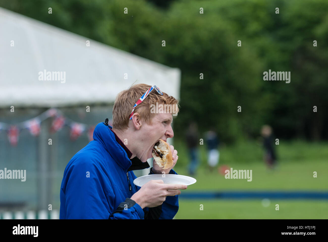 Person eating a snack Stock Photo - Alamy
