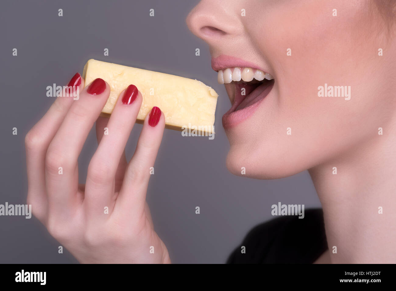 Woman holding piece cheese hi-res stock photography and images - Alamy