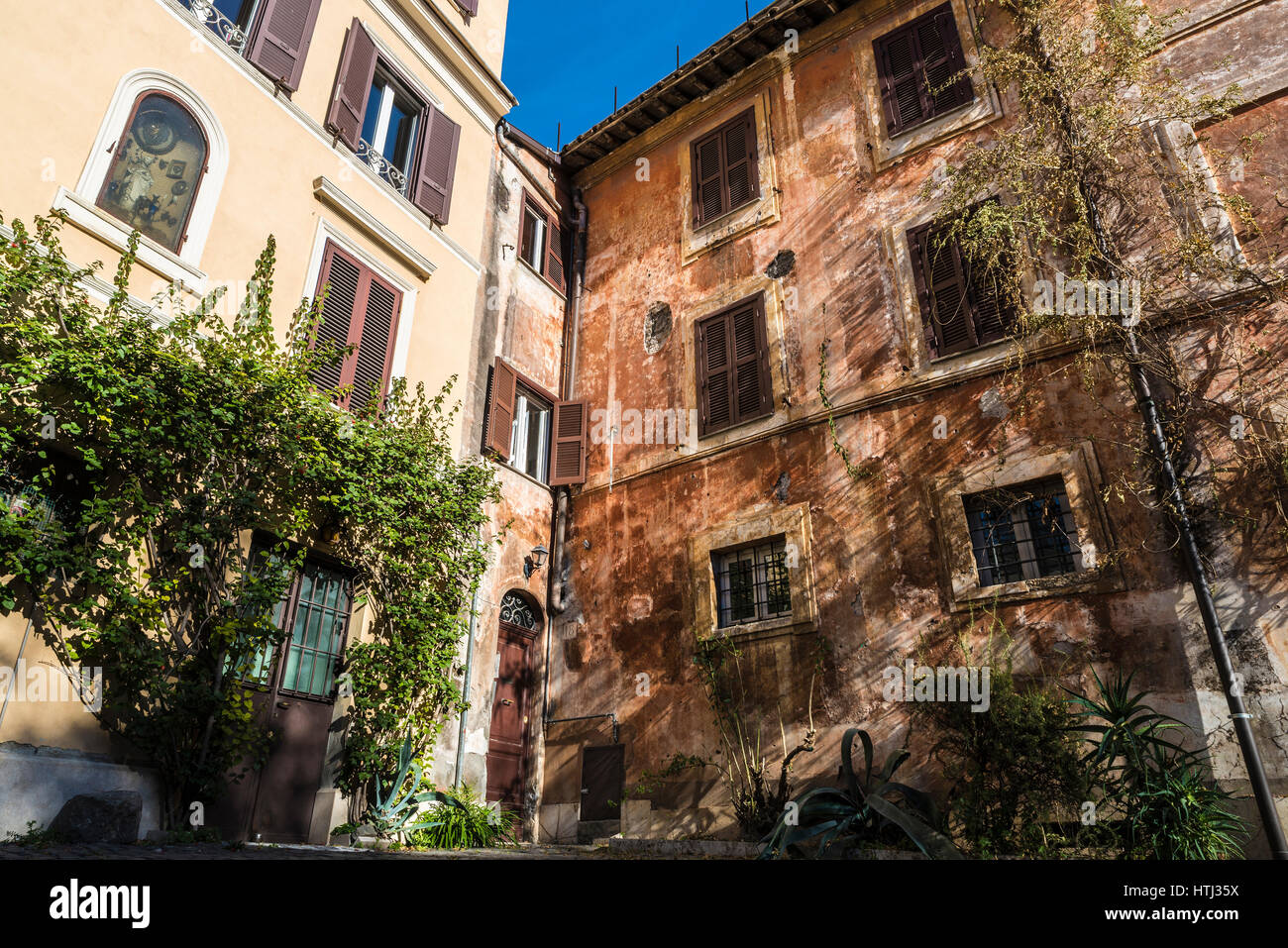 Facade of an old classic building in the historical center of Rome ...