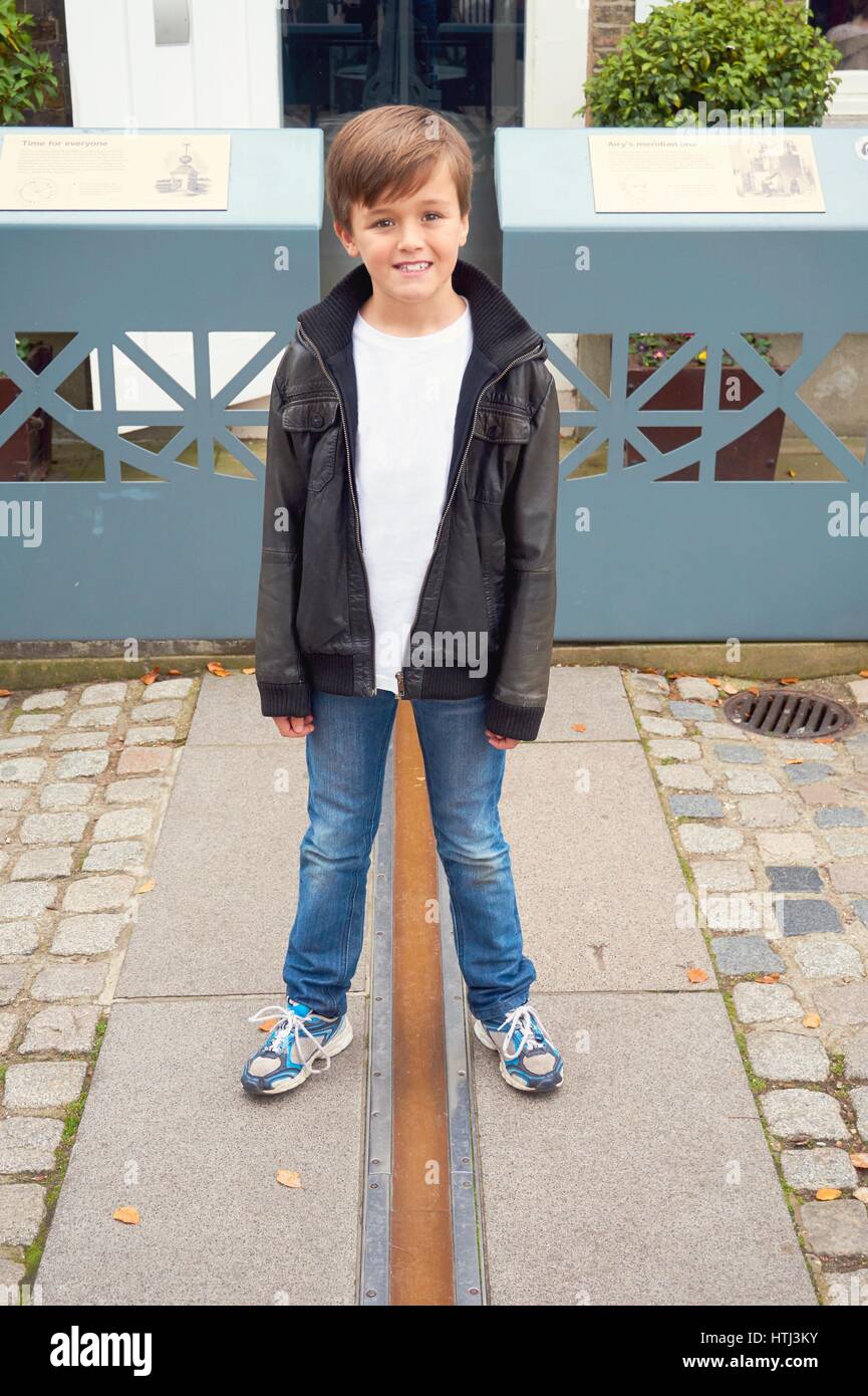 Greenwich, London, UK - October 30 2016: Small boy stands astride the ...