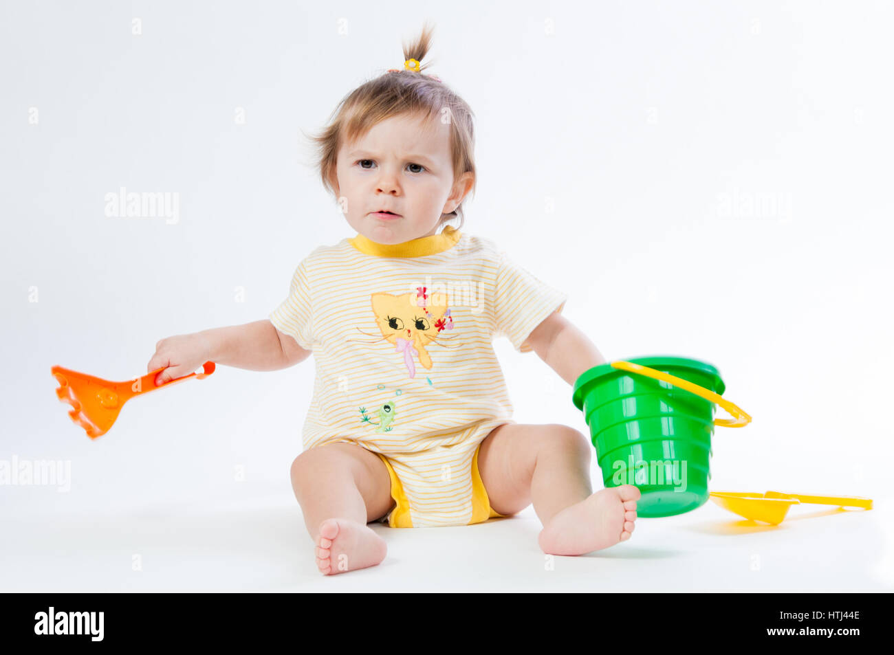 Cute baby with bucket and spade isolated on white background Stock ...