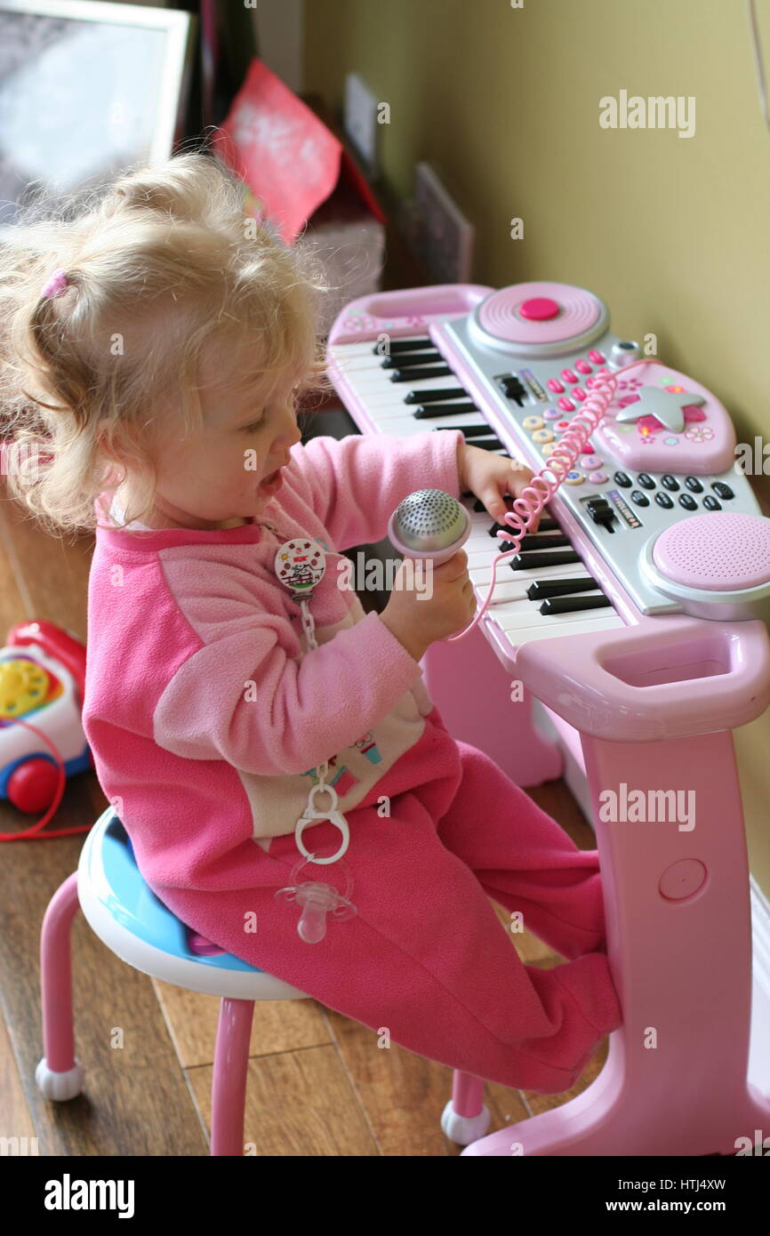 toddler playing on the keyboard Stock Photo - Alamy