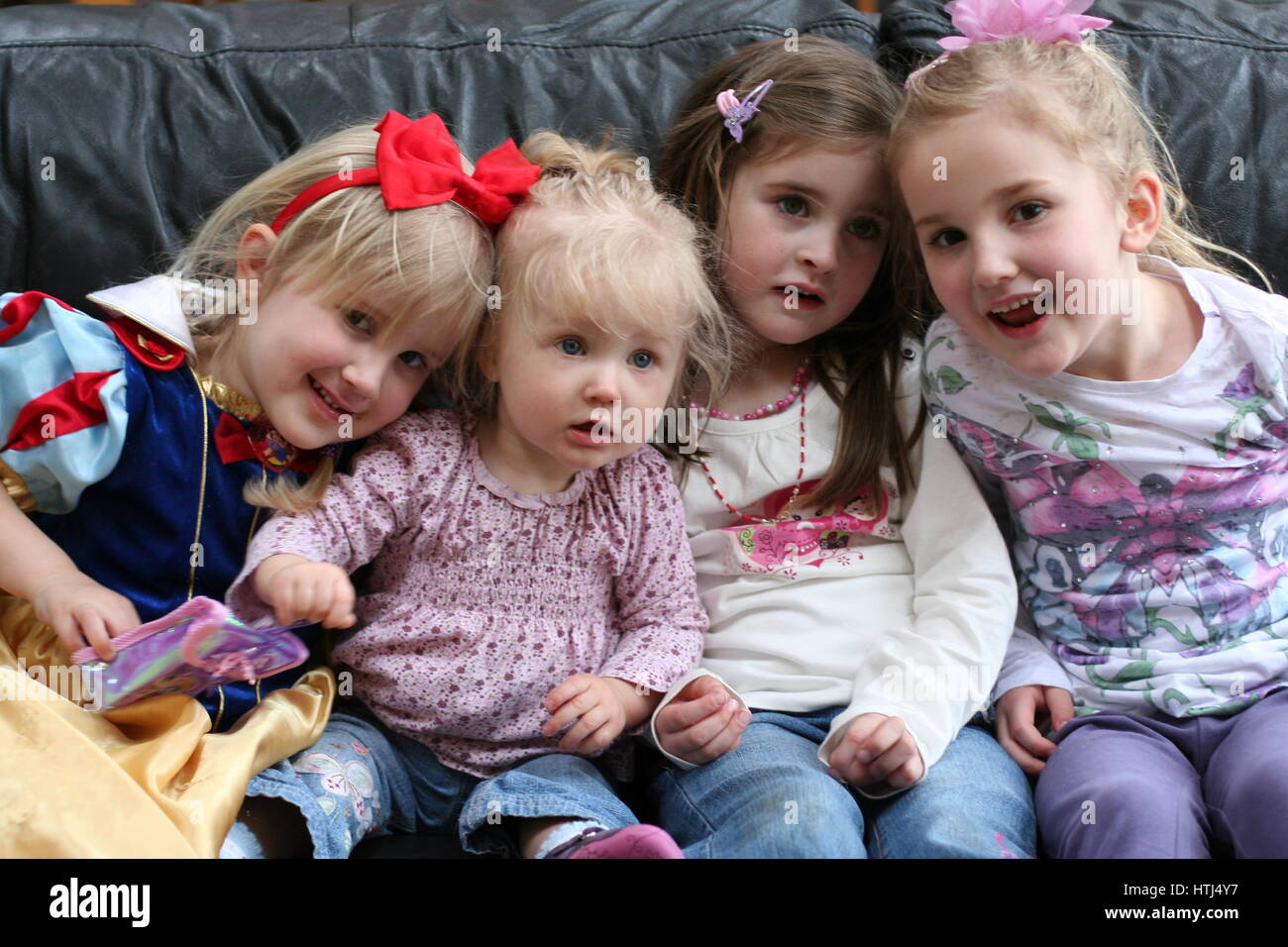girls sitting together Stock Photo - Alamy
