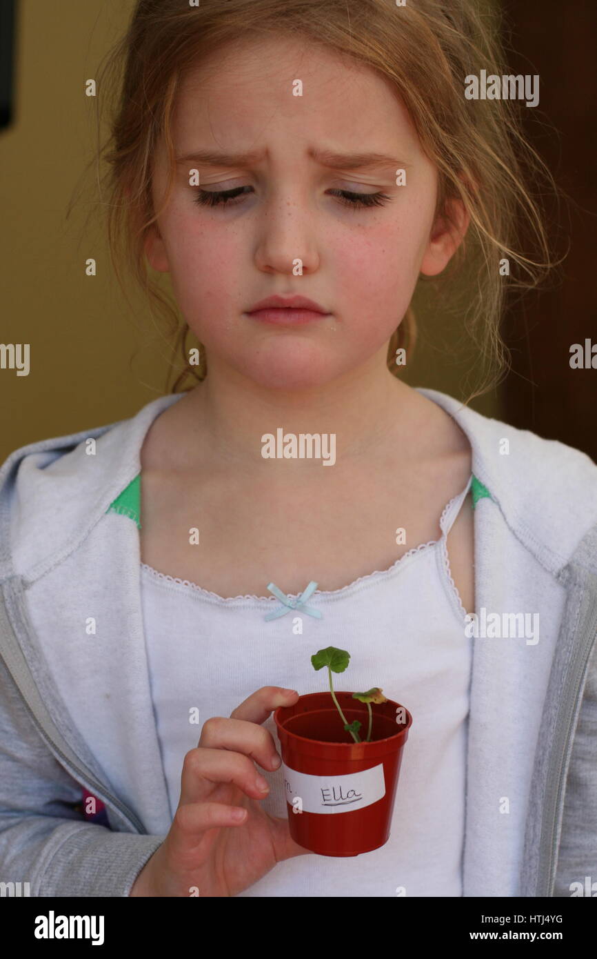 Girl child kid with a disappointed look on her face or sad face ...