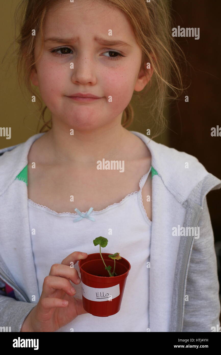 Girl child kid with a disappointed look on her face or sad face ...