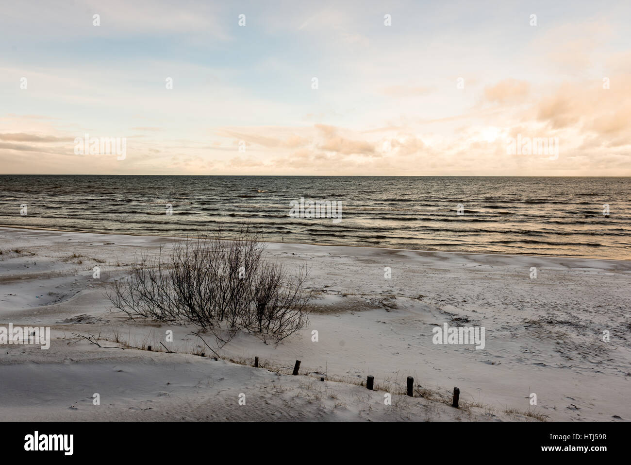 frozen countryside scene in winter with snow. beach scene with ice ...