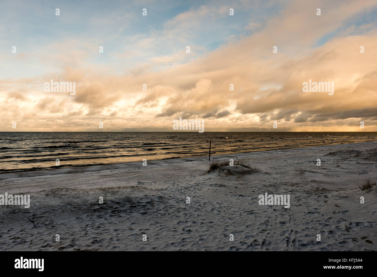 frozen countryside scene in winter with snow. beach scene with ice ...