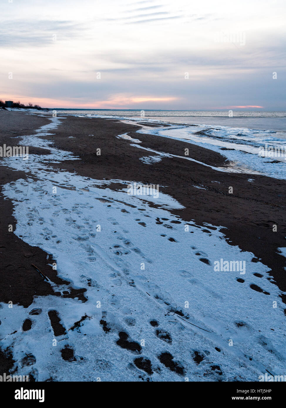 frozen countryside scene in winter with snow. beach scene with ice ...