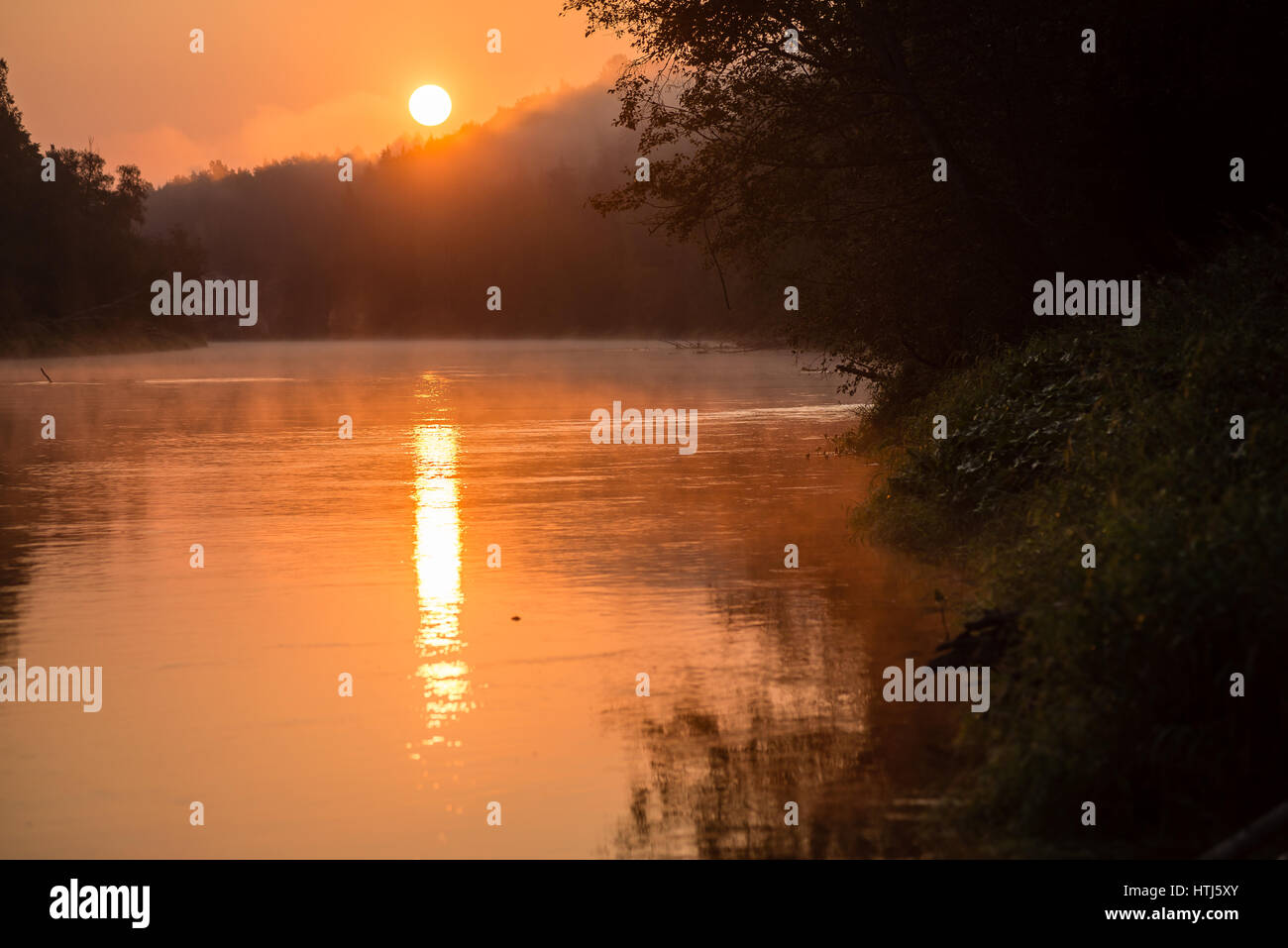 colorful orange sunrise over the lake in summer Stock Photo - Alamy
