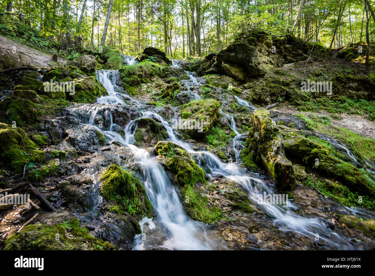 rocky waterfall in summer with stream and low water in forest Stock ...