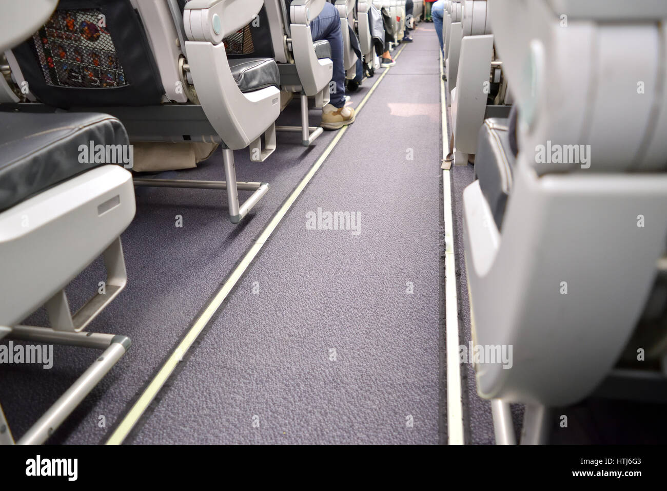 Passengers during a flight in an airplane Stock Photo - Alamy