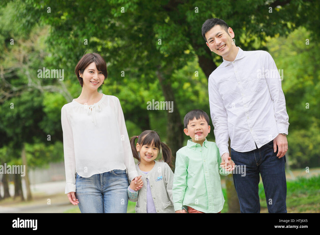 Japanese family in a city park Stock Photo - Alamy