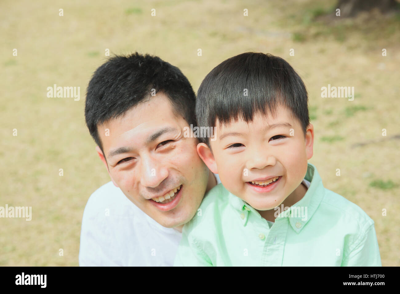 Japanese father and son in a city park Stock Photo - Alamy