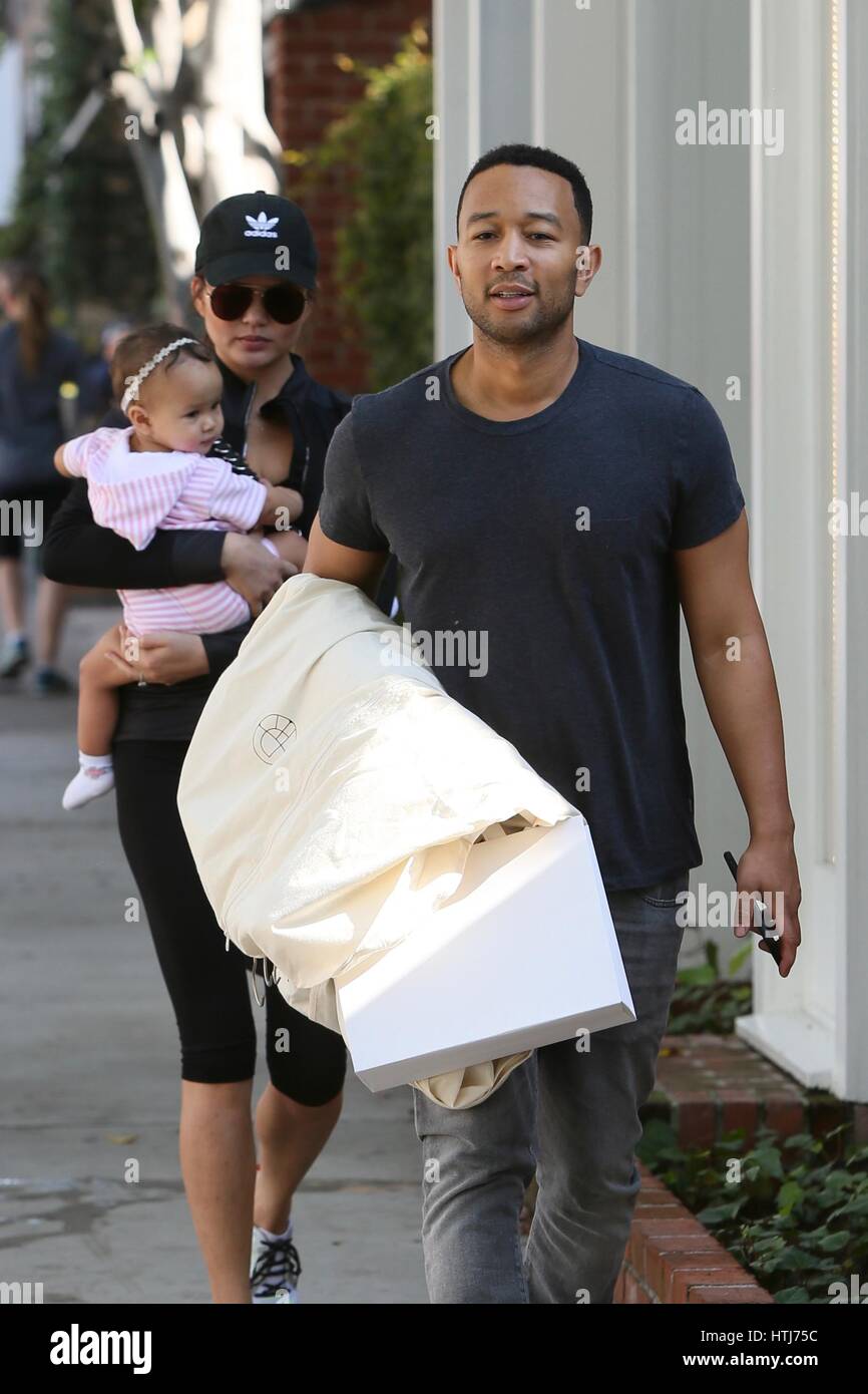 Chrissy Teigen and John Legend shop at The Row with their daughter Luna ...