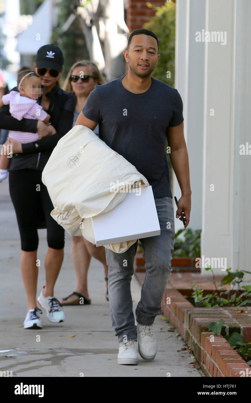Chrissy Teigen and John Legend shop at The Row with their daughter Luna ...
