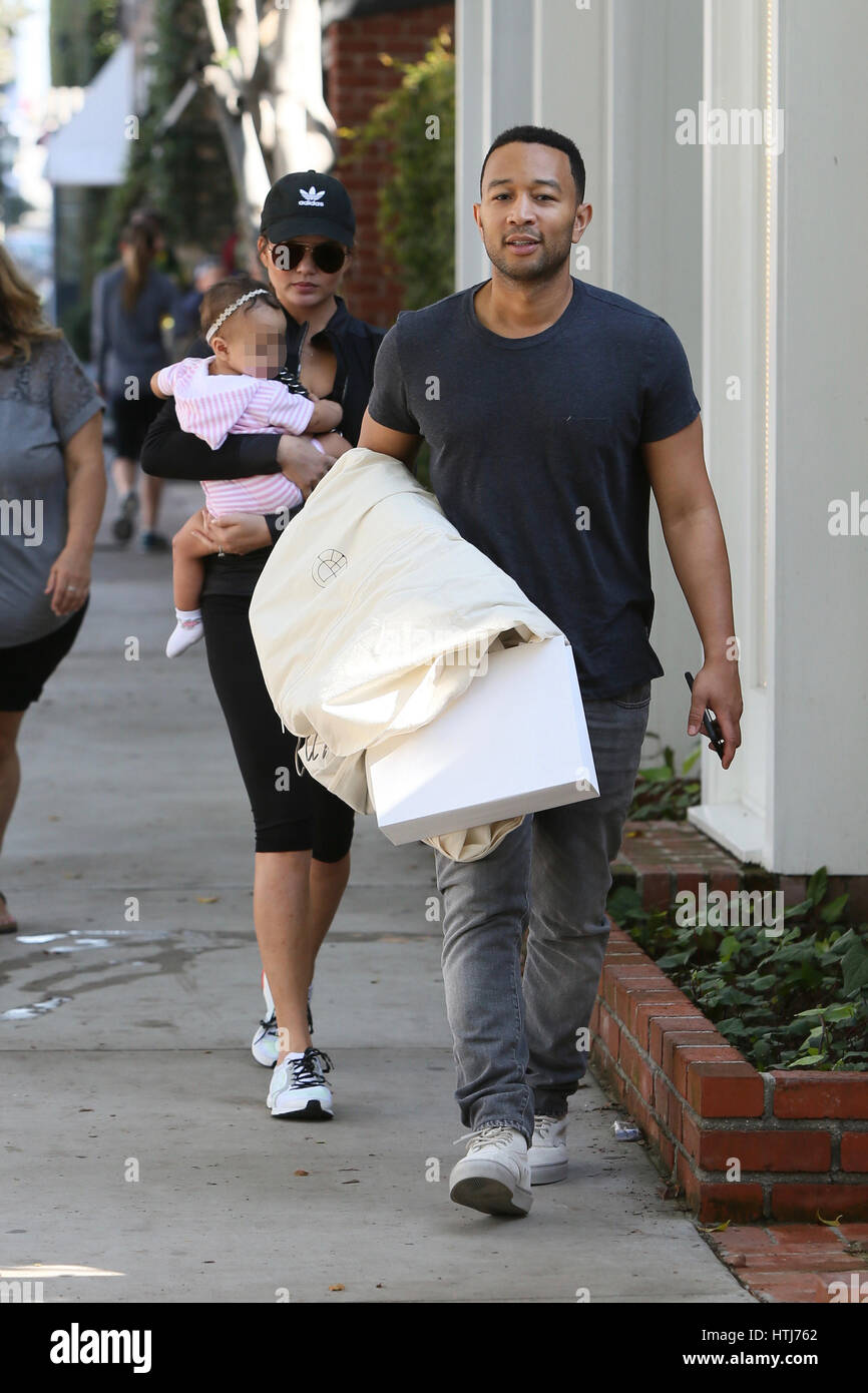 Chrissy Teigen and John Legend shop at The Row with their daughter Luna ...
