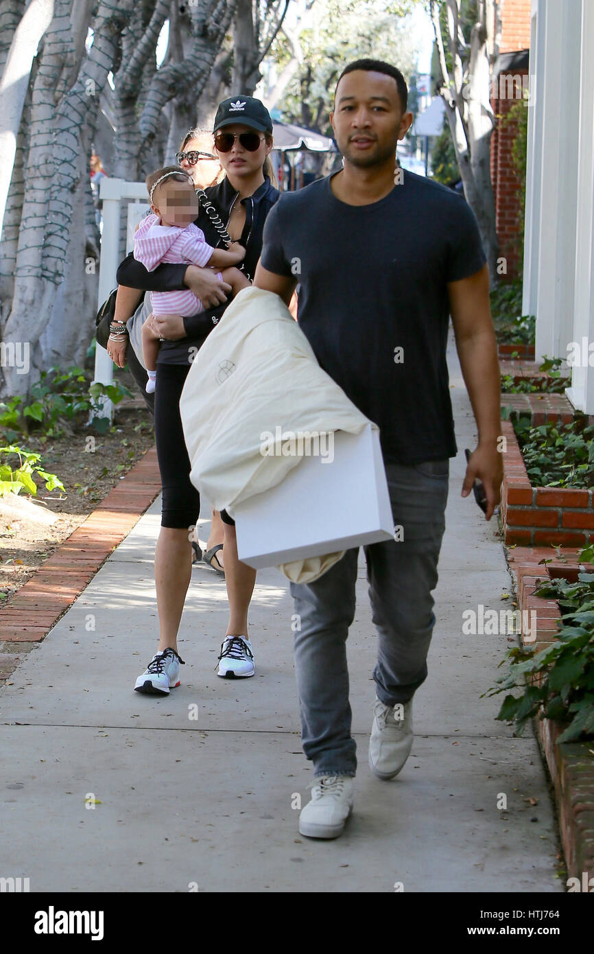 Chrissy Teigen and John Legend shop at The Row with their daughter Luna ...