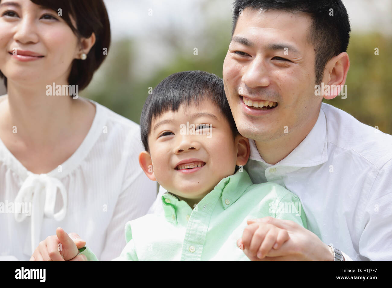 Japanese family in a city park Stock Photo - Alamy