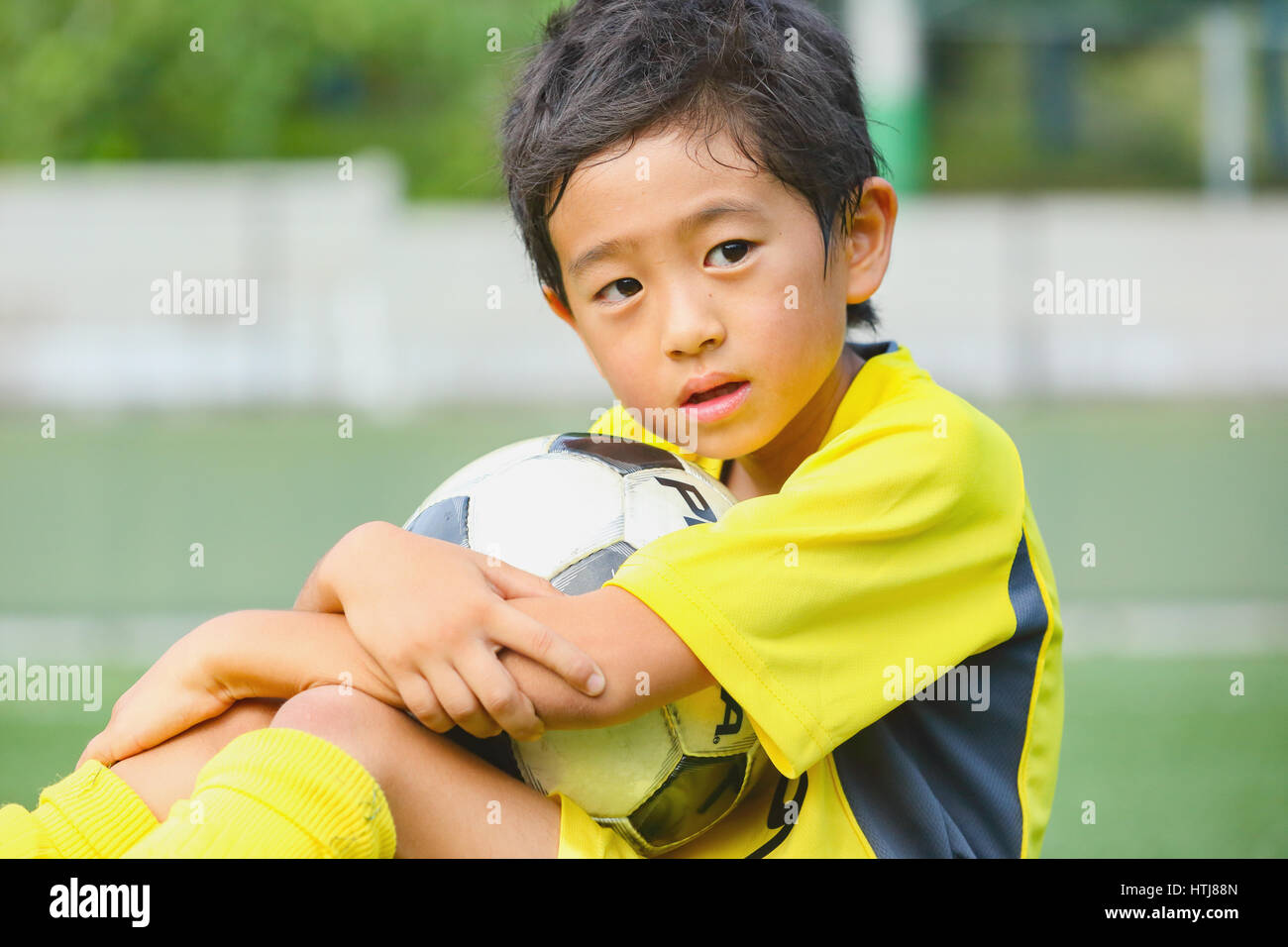 Japanese kid playing soccer Stock Photo - Alamy