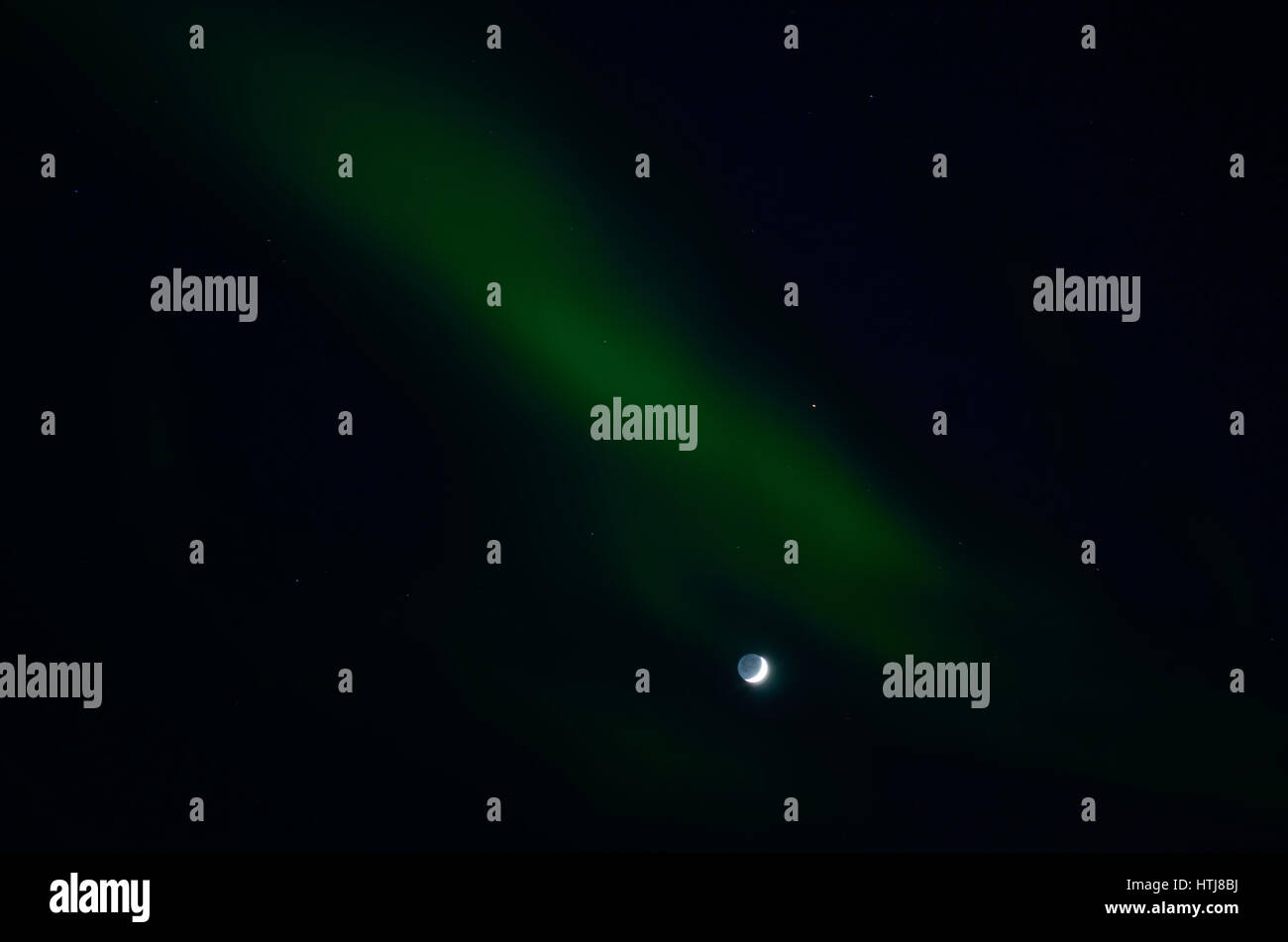 aurora borealis and full moon in winter night in the deep arctic circle ...