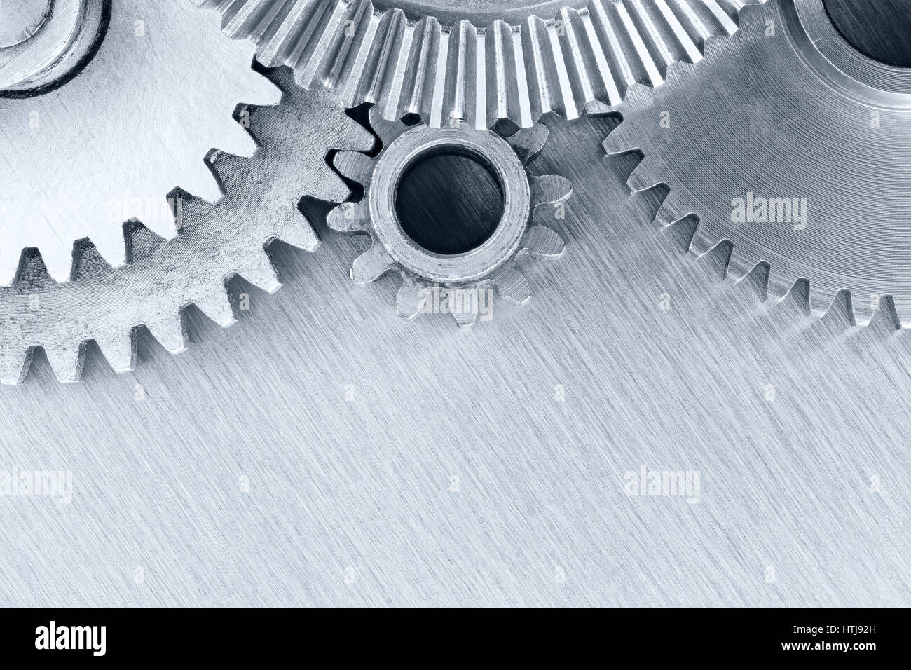 set of industrial metal cogwheels on scratched steel background Stock ...