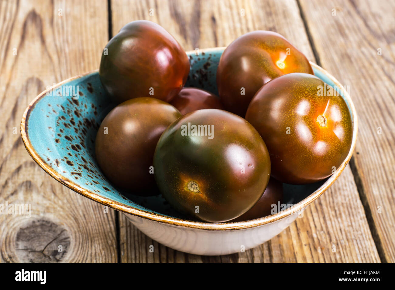 Black tomatoes Kumata. Studio Photo Stock Photo - Alamy
