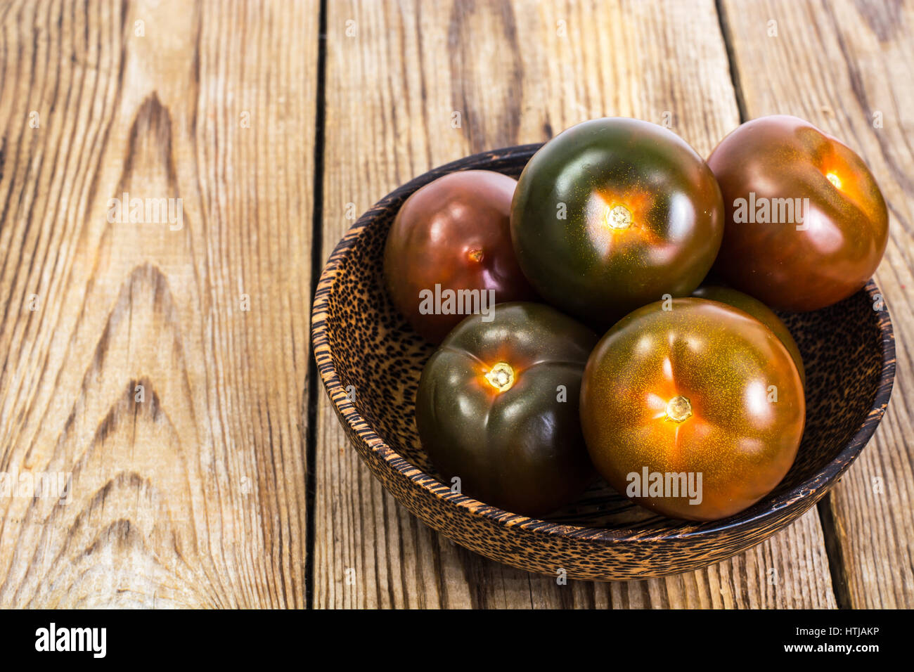 Black tomatoes Kumata. Studio Photo Stock Photo - Alamy