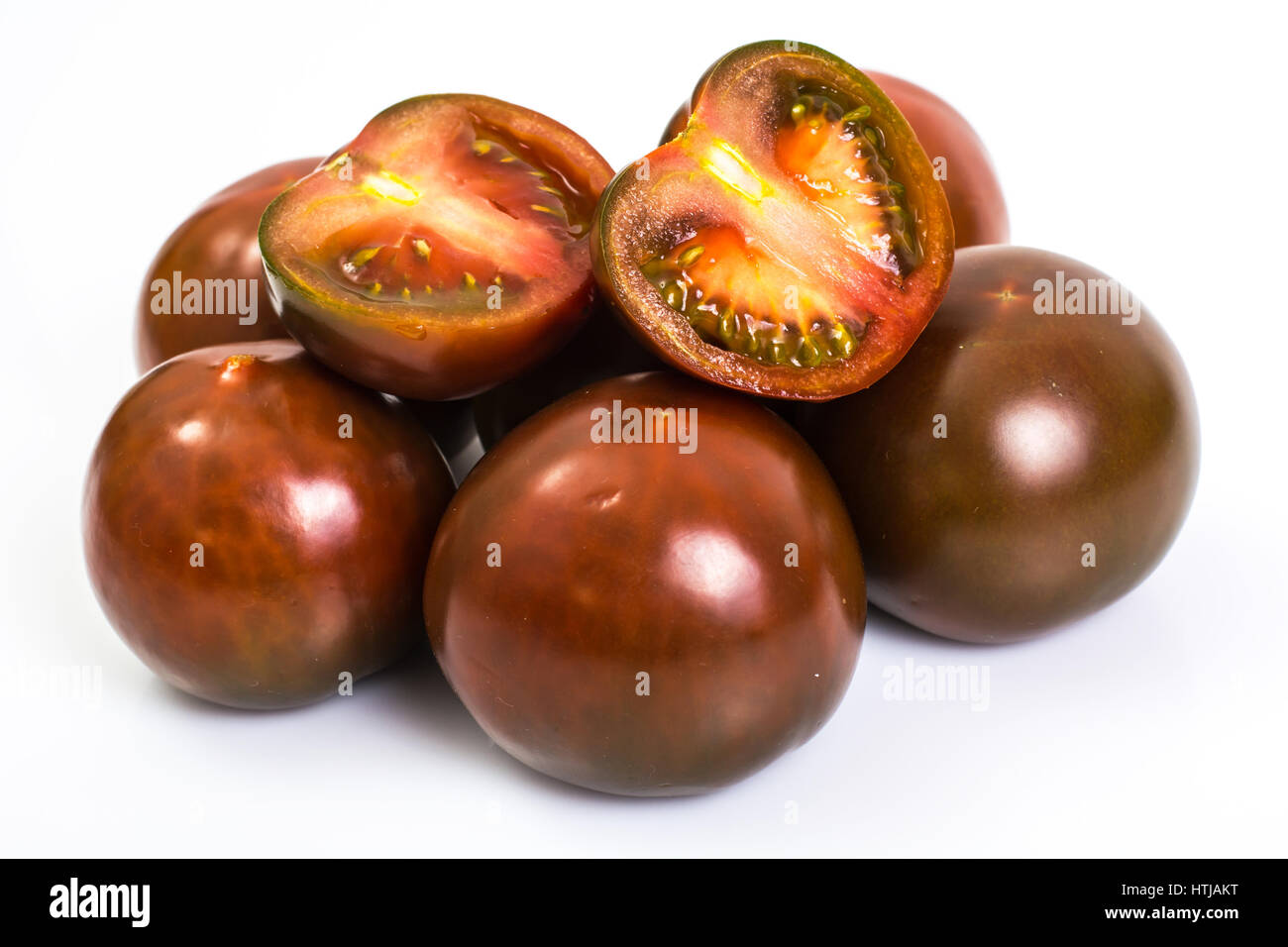 Black tomatoes Kumata. Studio Photo Stock Photo - Alamy