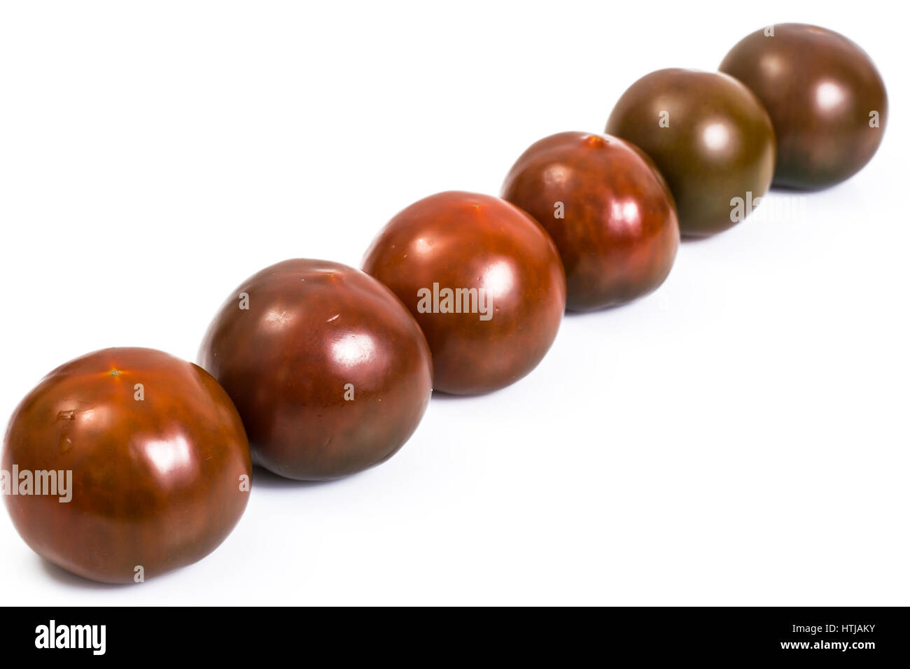 Black tomatoes Kumata. Studio Photo Stock Photo - Alamy