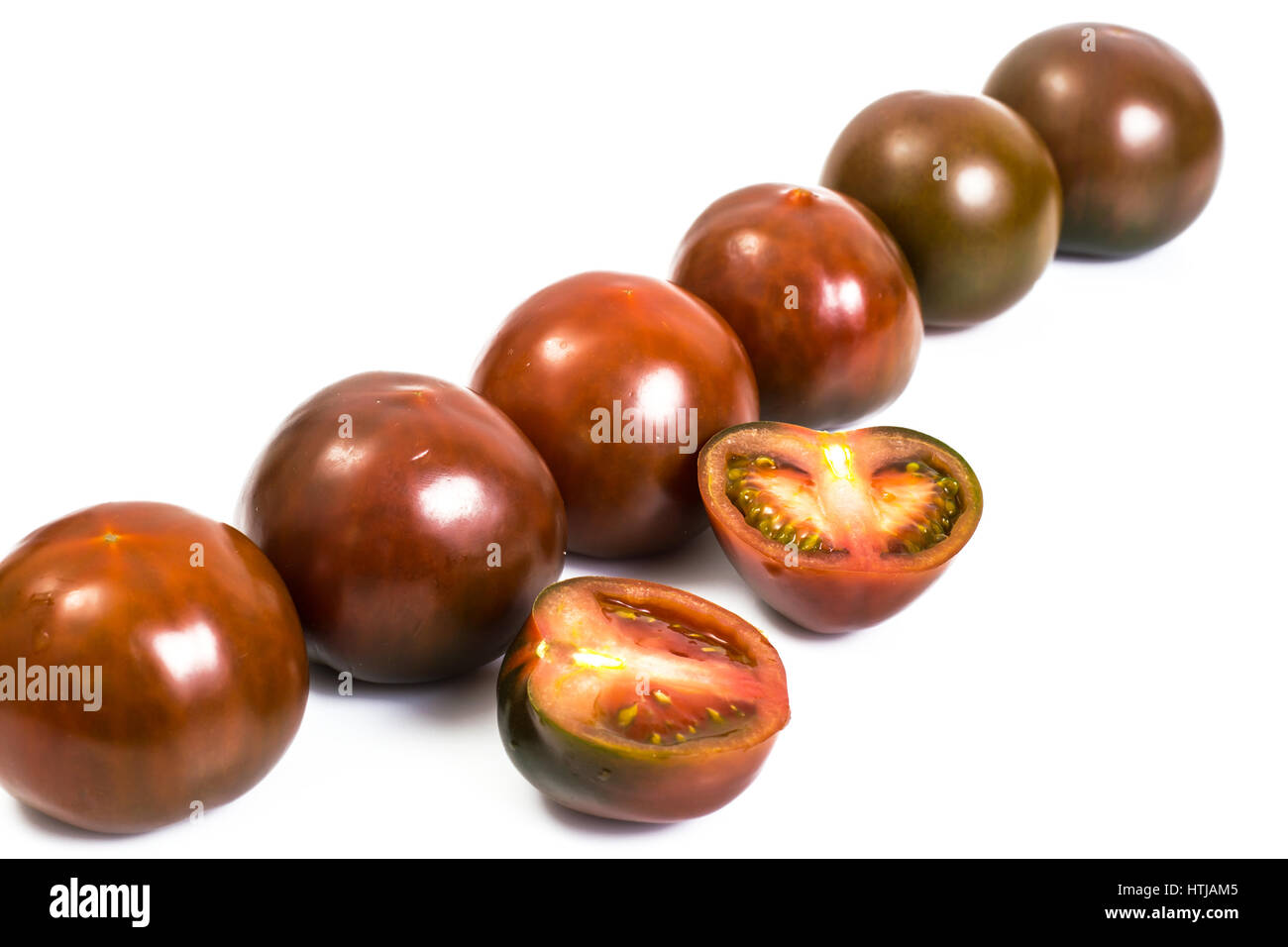 Black tomatoes Kumata. Studio Photo Stock Photo - Alamy